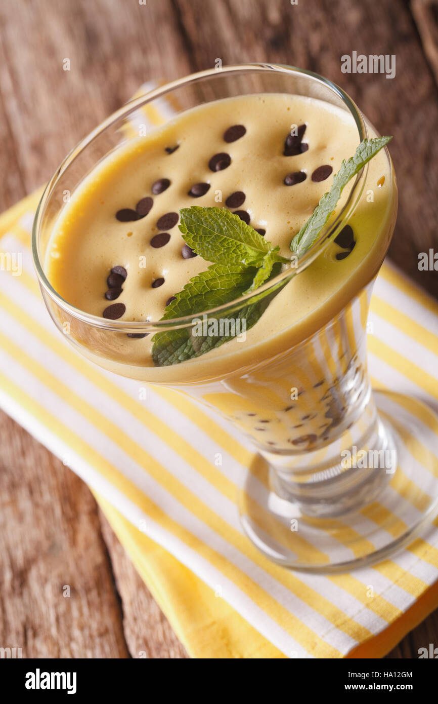Italian Zabaione cream with chocolate and mint close up in a glass on ...