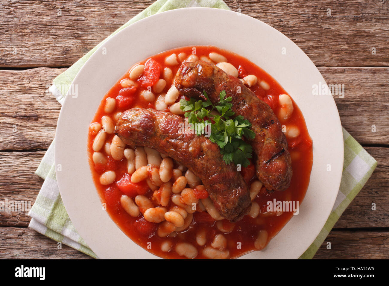 Beans with grilled sausage, traditional european homemade meal on a ...