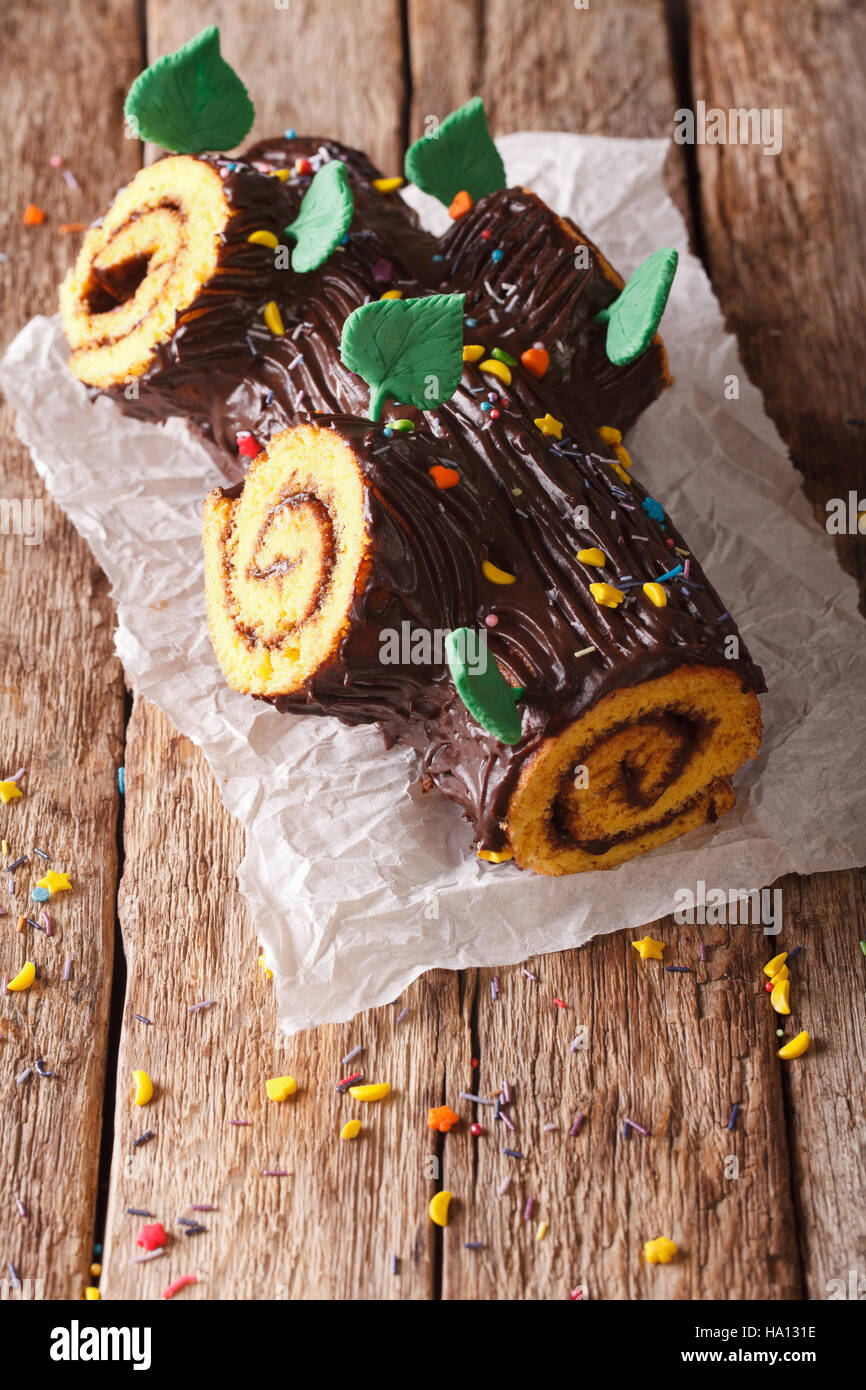 homemade buche de noel, chocolate yule log christmas cake. Vertical ...