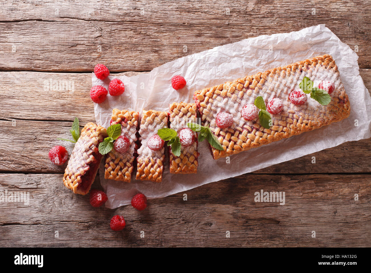 Sliced freshly baked raspberry pie close-up on the table. Horizontal ...
