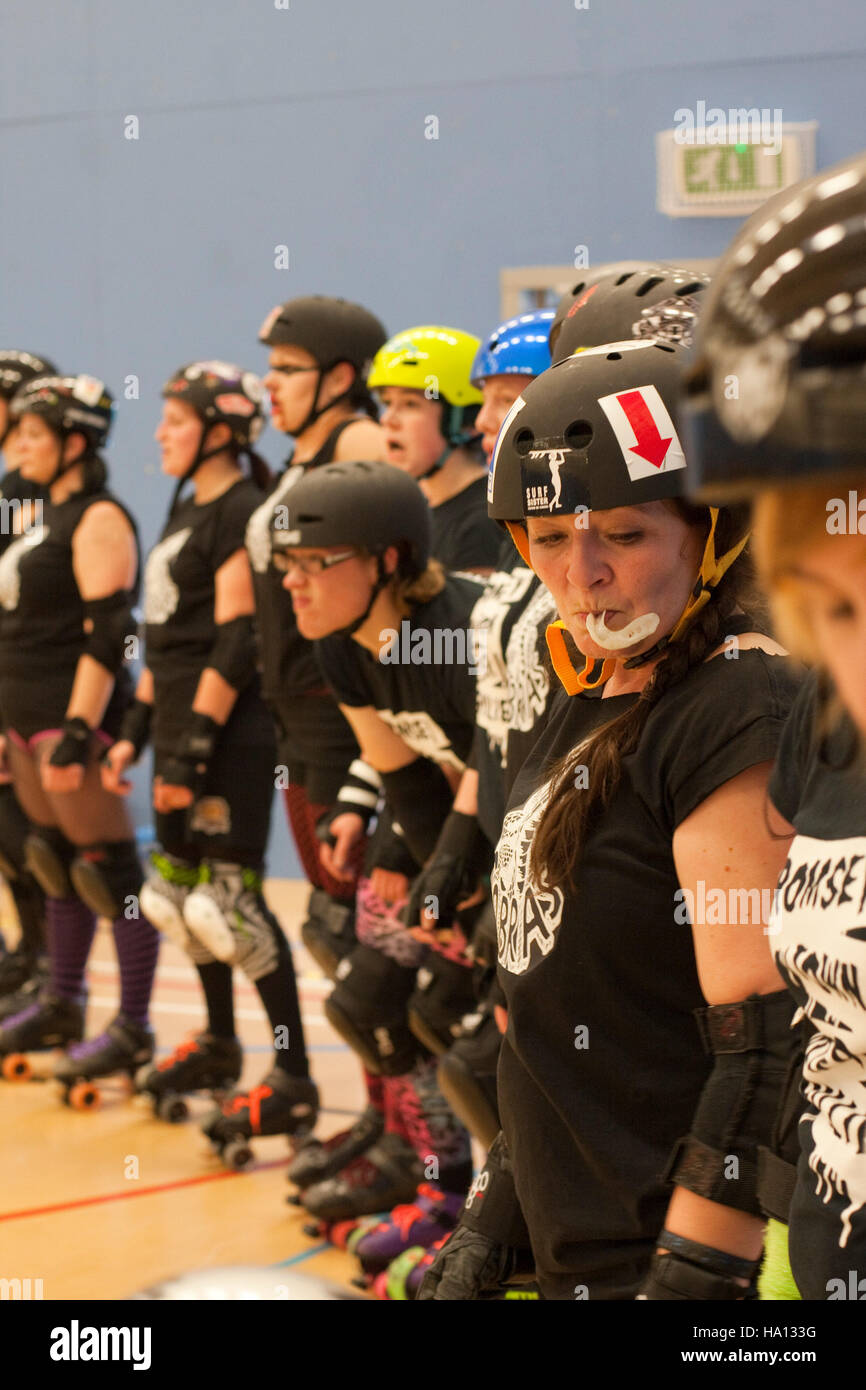Women roller derby skaters line up before a bout Stock Photo - Alamy