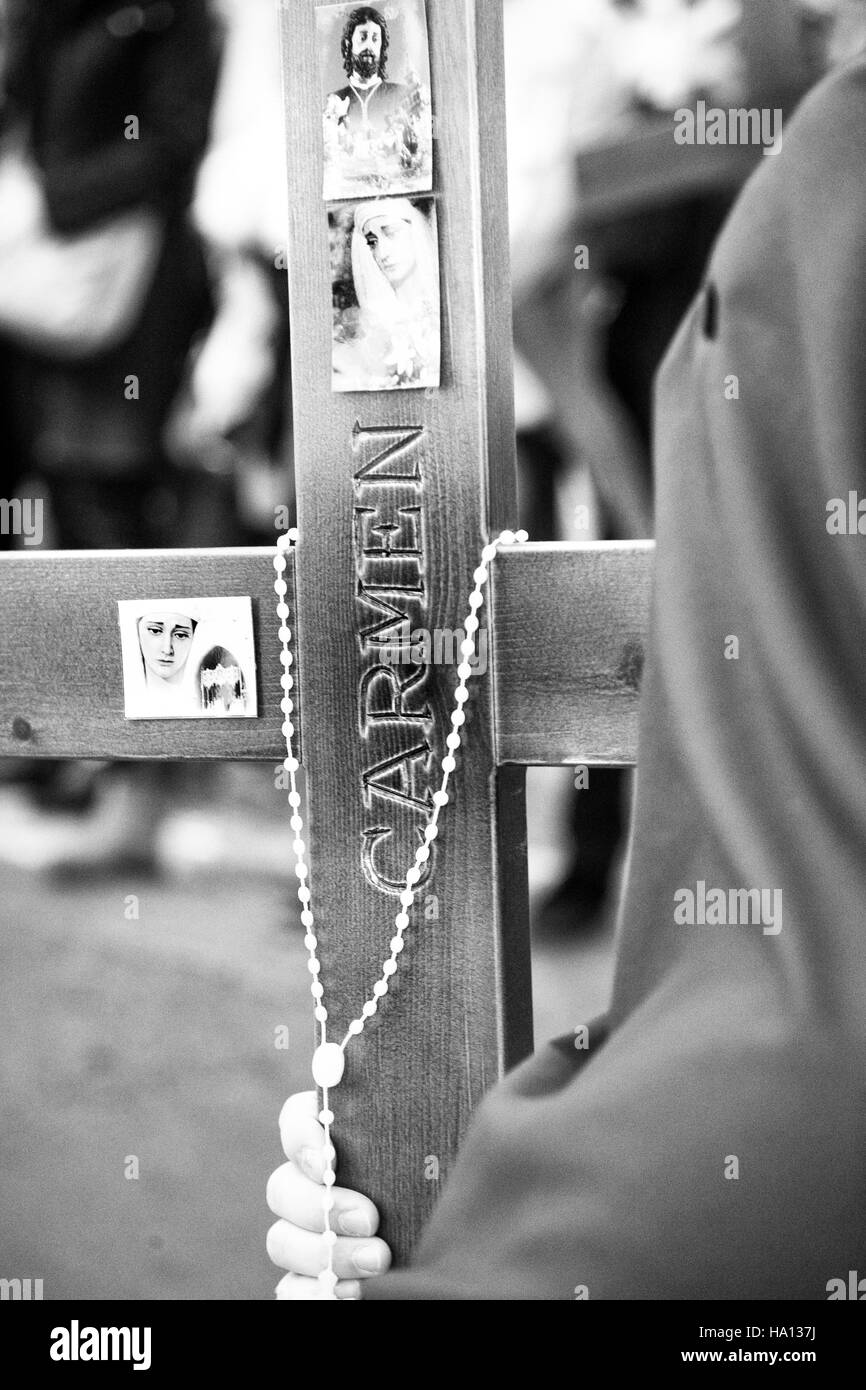 Woman carrying a wooden cross during the holy procession semana santa ...