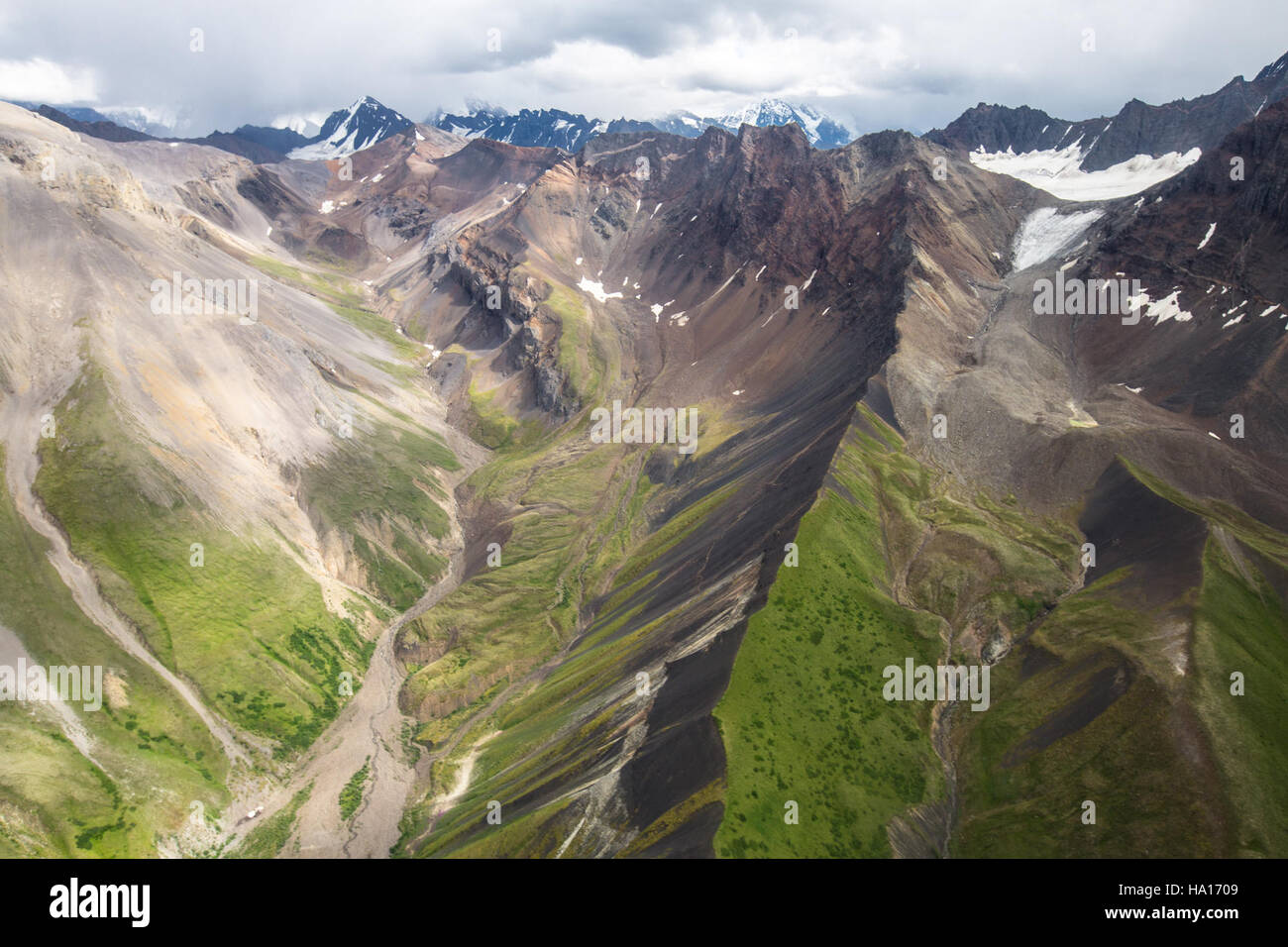 This image captures Pyramid Peak’s western flank in Alaska, showcasing ...