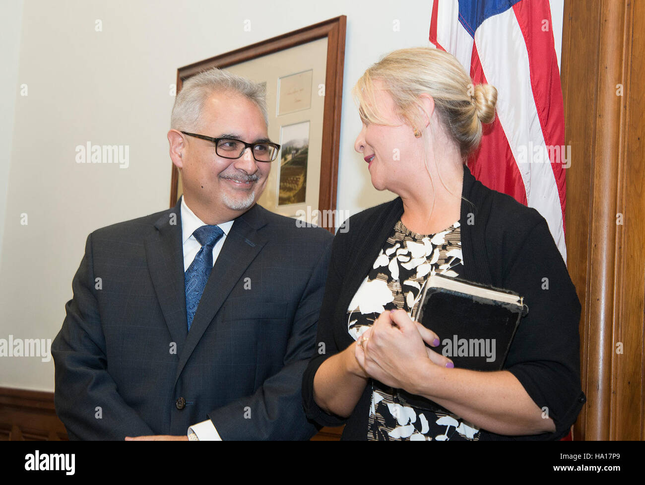 The image captures the swearing-in ceremony of Jeff Prieto as the ...