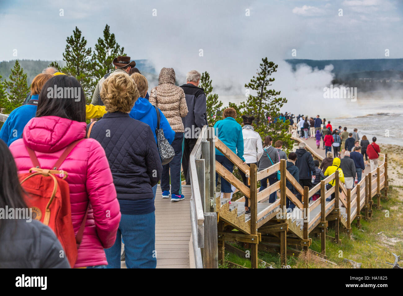 This image shows a crowded boardwalk in Yellowstone's Lower Geyser ...