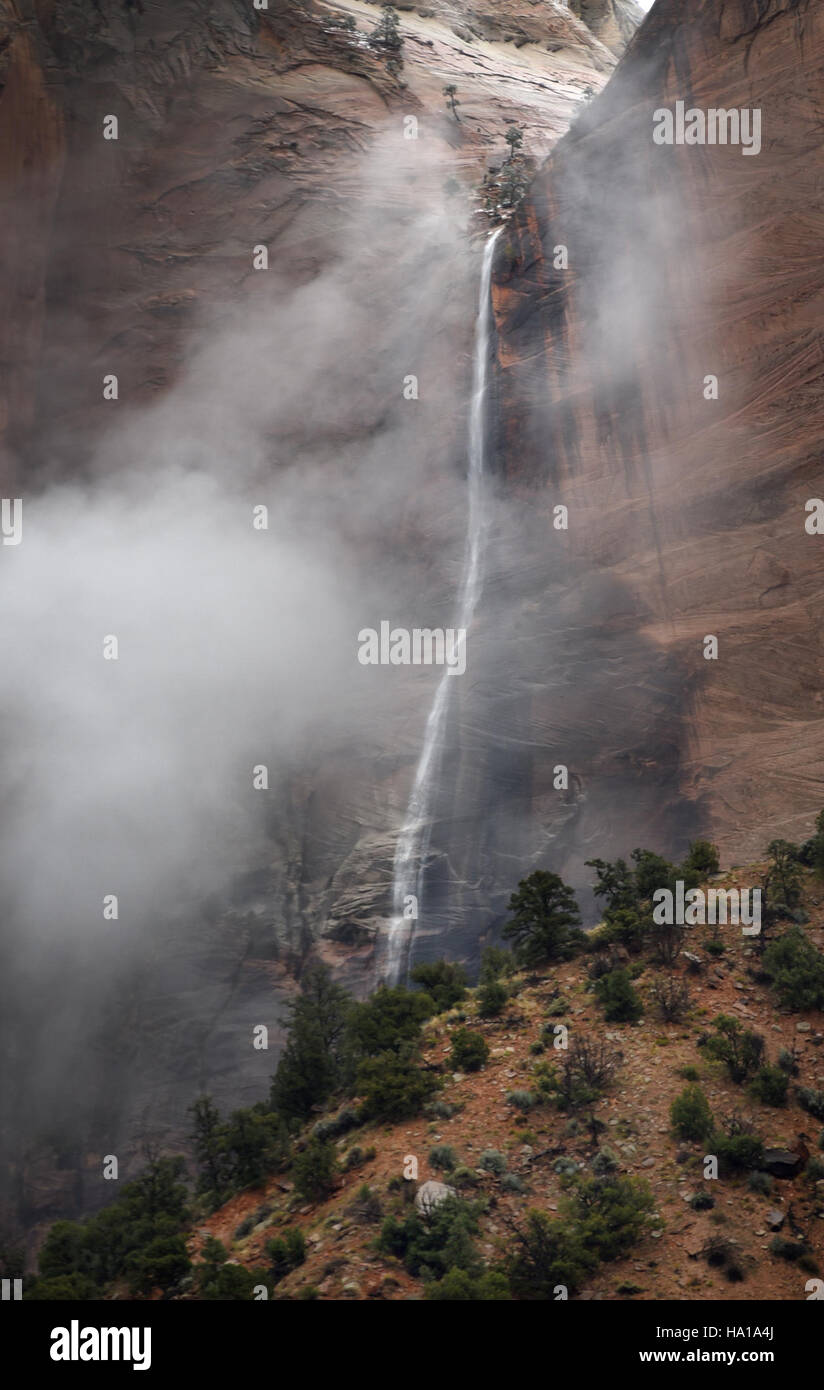 A majestic waterfall within Zion National Park, illustrating the park's ...