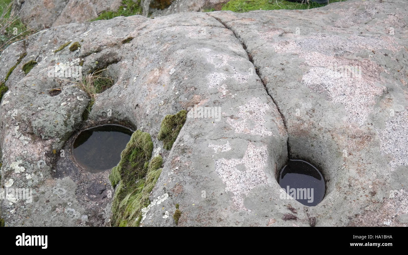 A bedrock mortar used by Native American tribes for grinding seeds ...