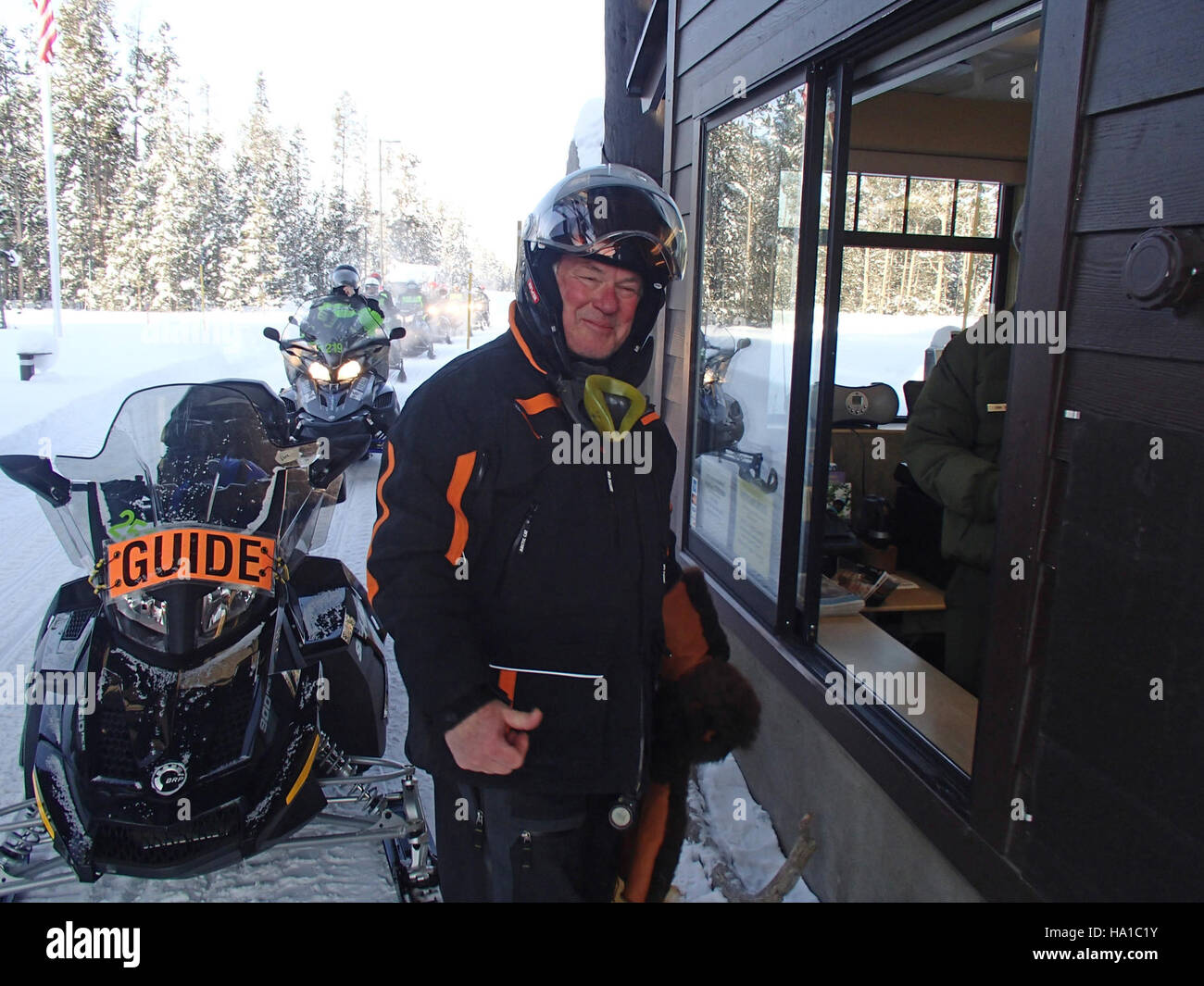 A snowmobile tour guide at Yellowstone National Park leads a winter ...