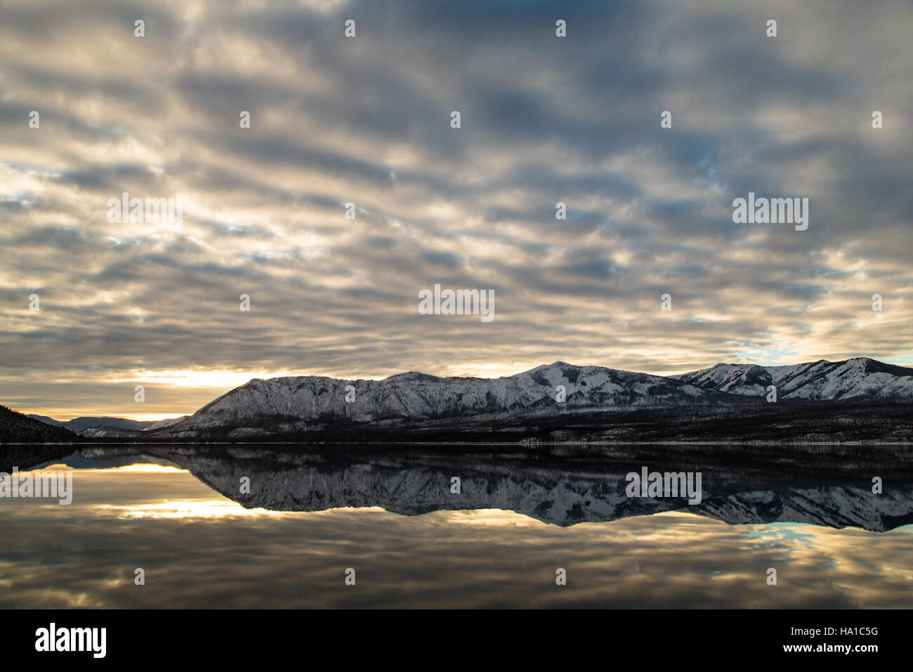 Floccus clouds hover over the Apgar Mountains in Glacier National Park ...