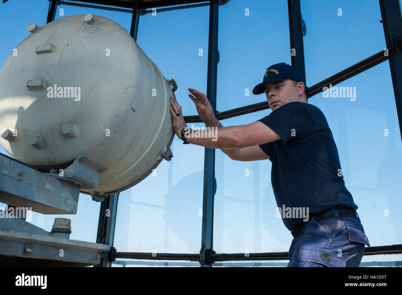 A lighthouse keeper inspects the light at Cape Hatteras National ...