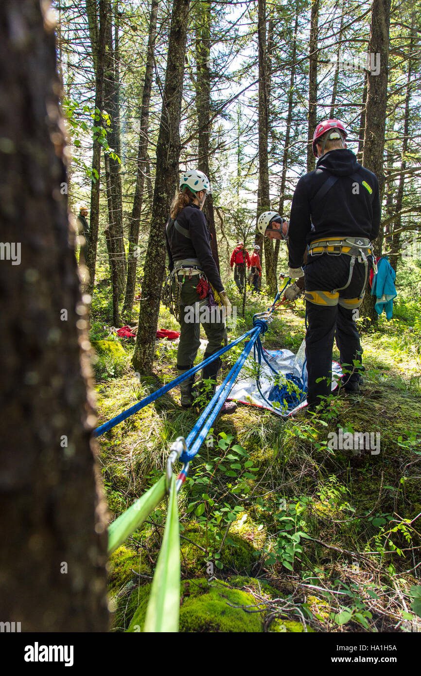 Search and Rescue (SAR) teams at Glacier National Park conduct high-angle rescue training to ...