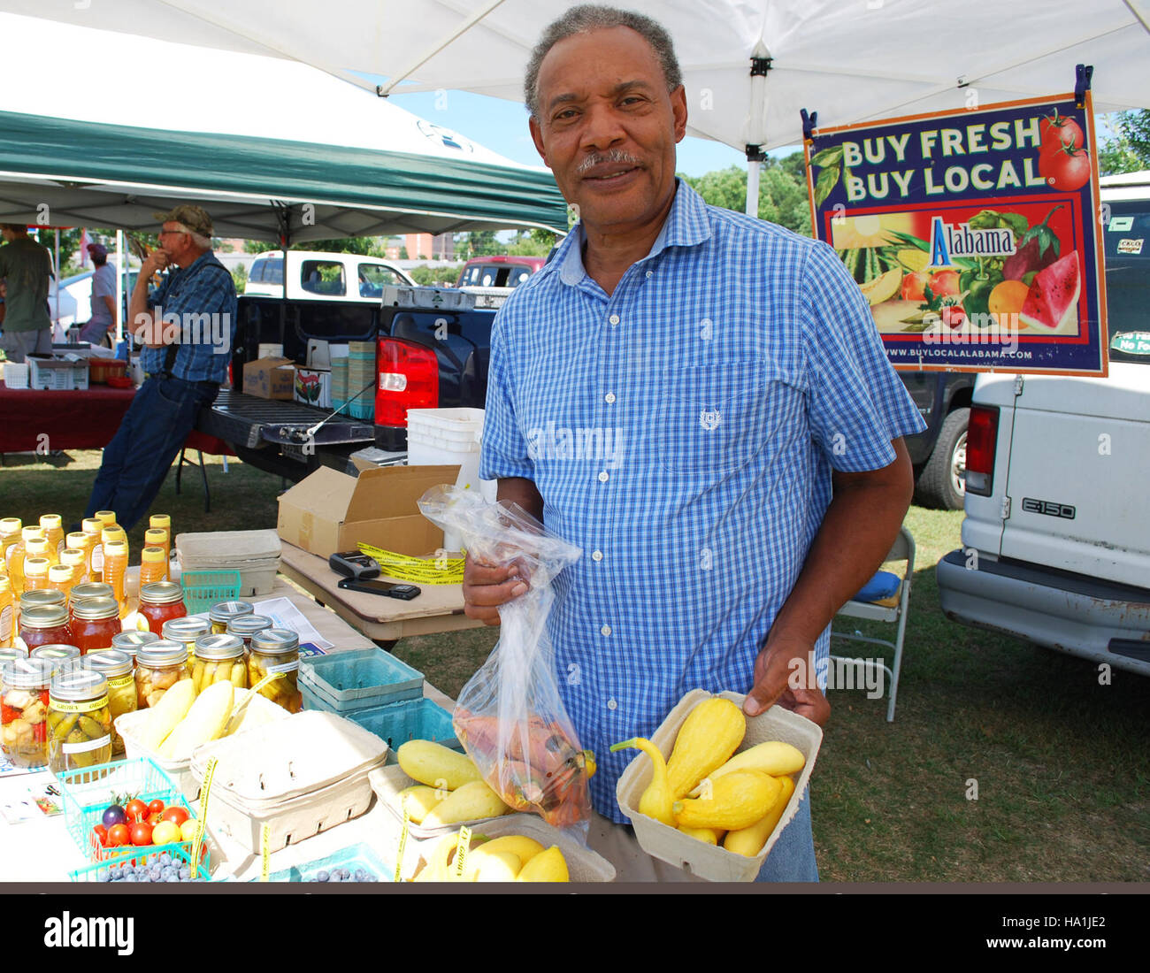 Photograph of Gene Thornton with his produce at Ag Heritage Park ...