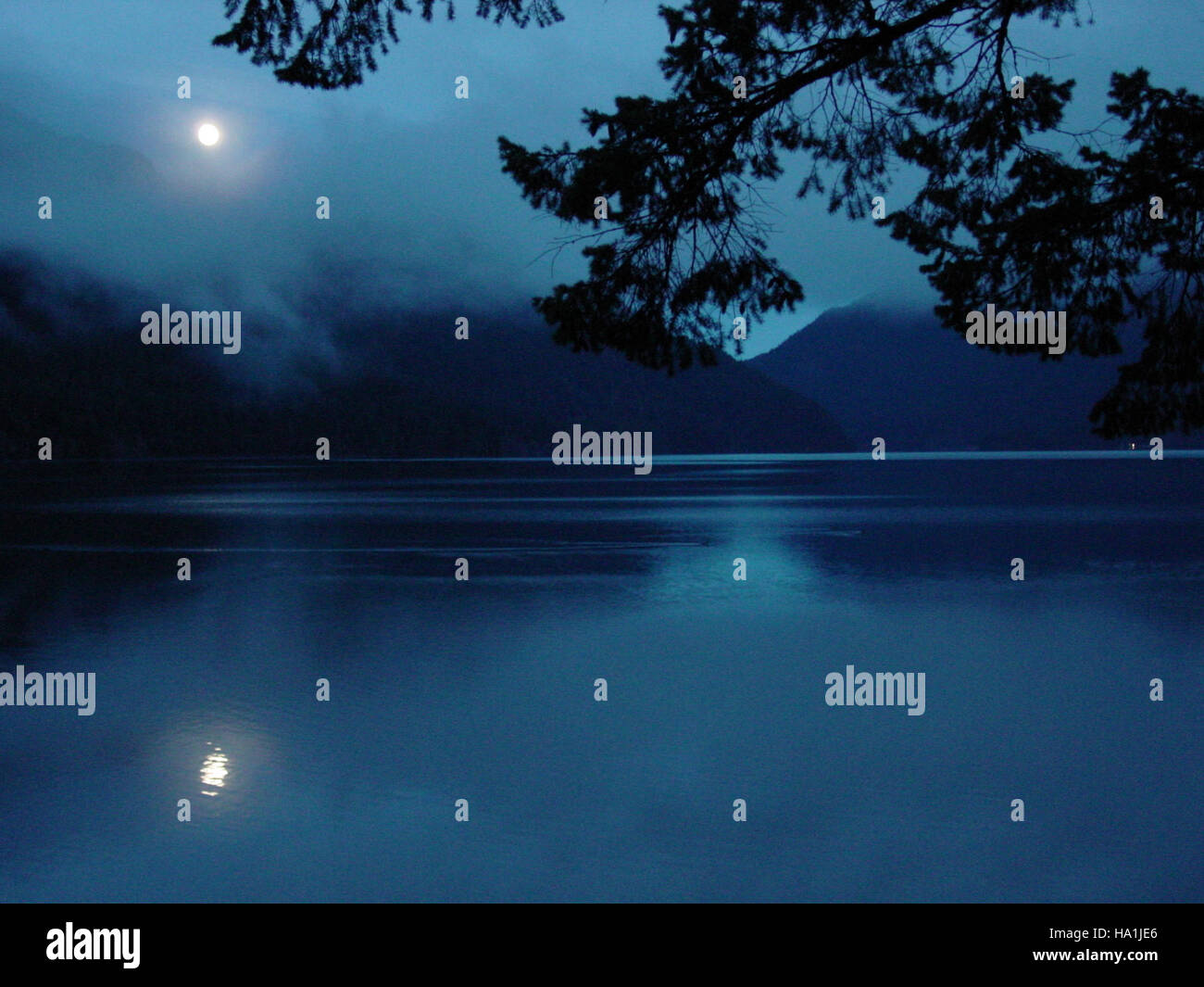 A serene image of Crescent Lake in Olympic National Park, reflecting ...