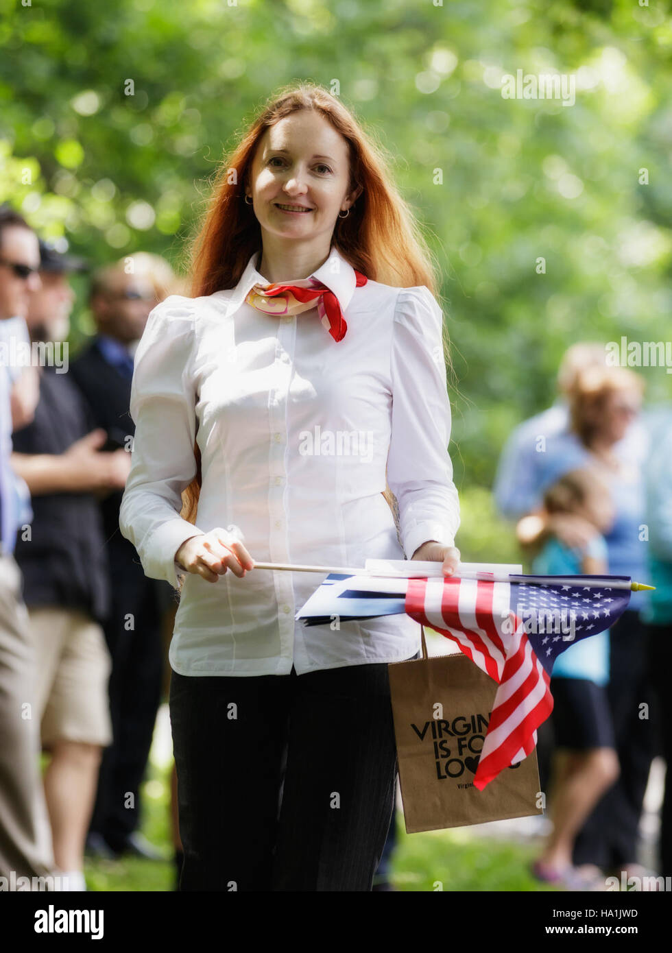 This image shows a naturalization ceremony, where individuals are sworn ...