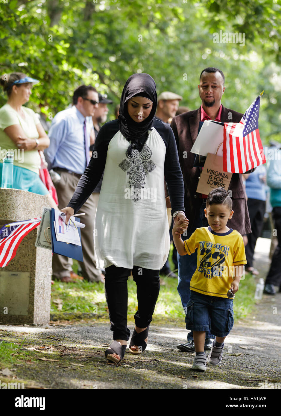 This image captures a naturalization ceremony, where new U.S. citizens ...