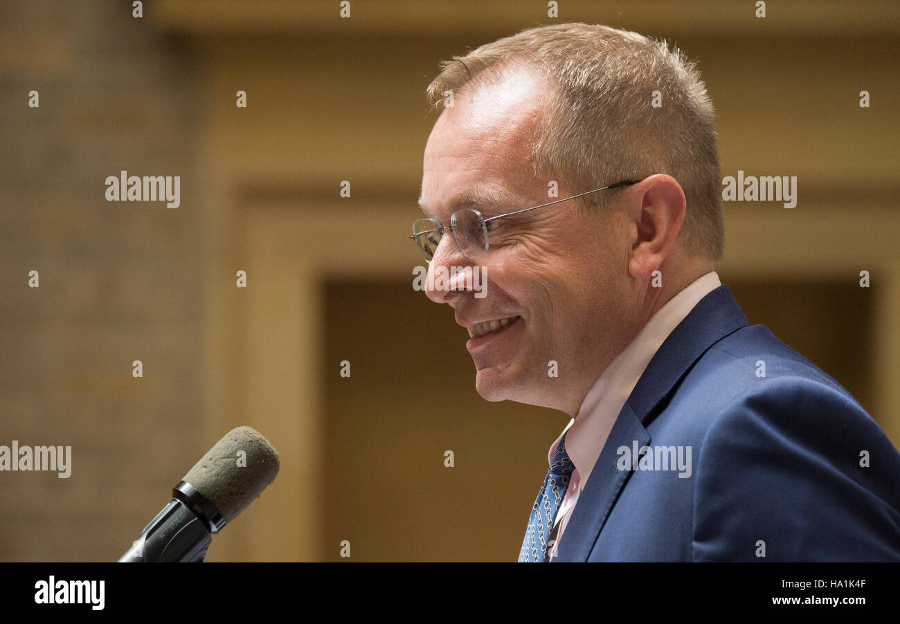 This image features the swearing-in ceremony of Phil Karsting as the ...