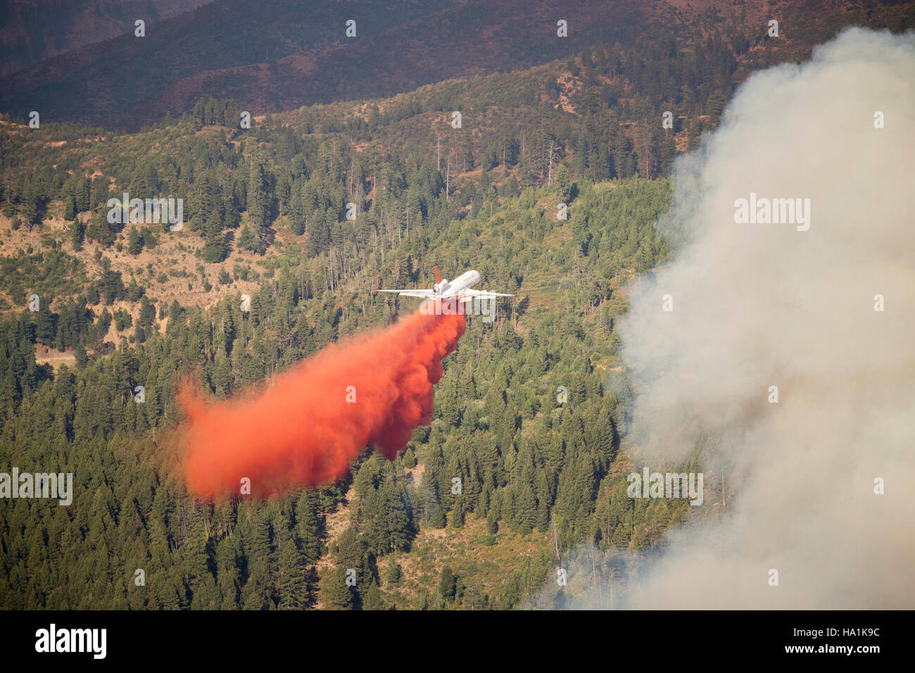 An aircraft is deployed to assist in wildfire suppression efforts ...