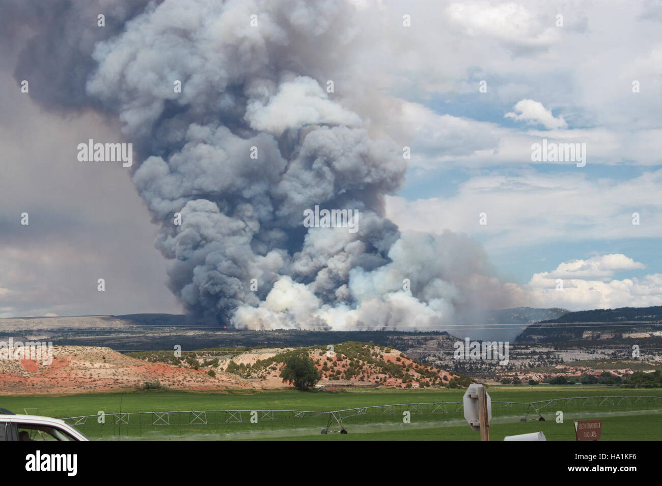 This image depicts a wildfire in Wyoming, showcasing the intense ...
