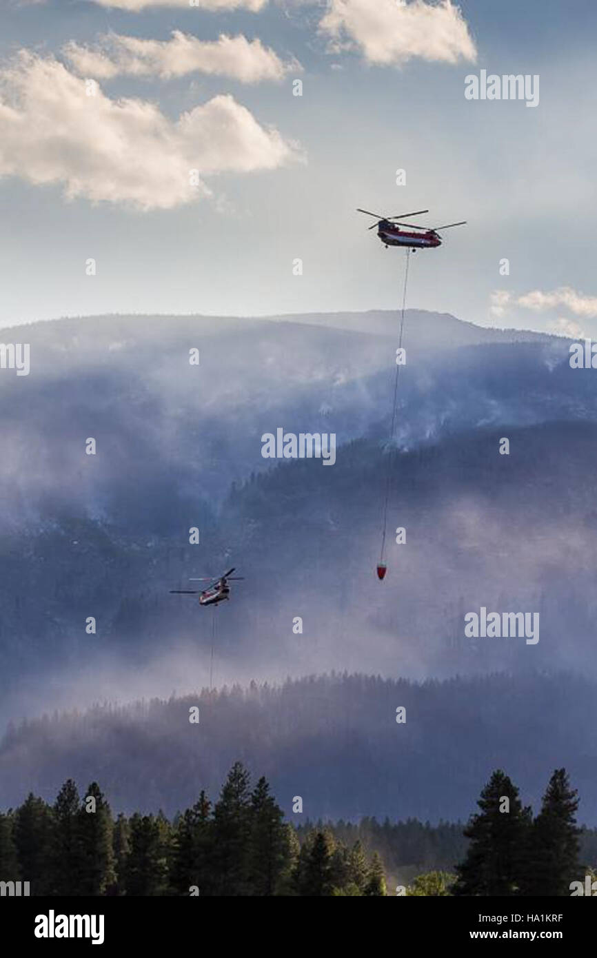Firefighting helicopter delivering water hi-res stock photography and ...