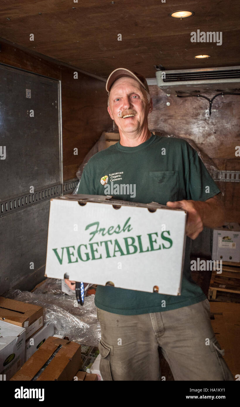 This image showcases the preparation of produce for Timber Pizza, a ...