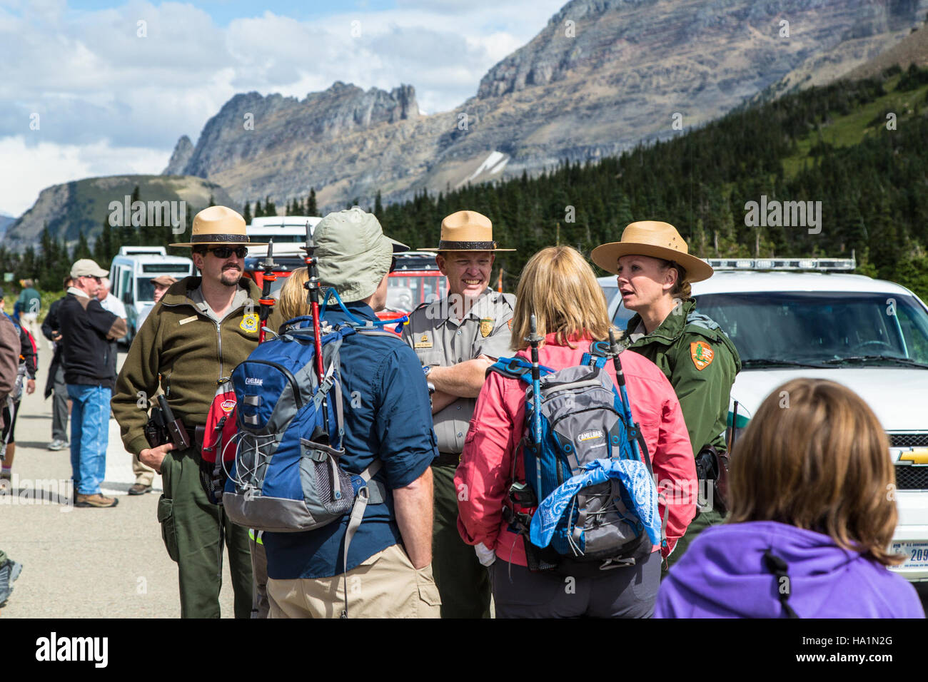 Rangers at Glacier National Park engage with visitors, providing ...