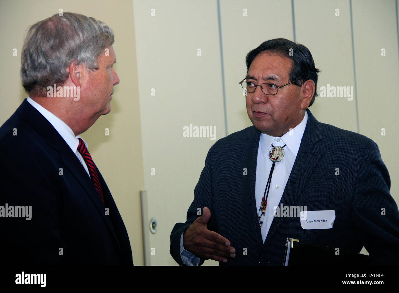 This image captures a roundtable discussion in Reno, Nevada, featuring ...