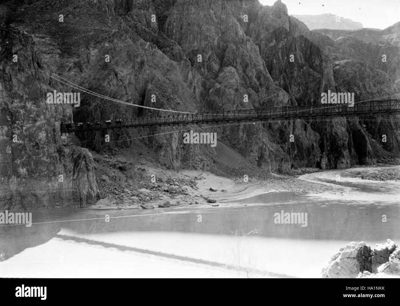 A historic photograph of a mule train crossing the Black Bridge in ...