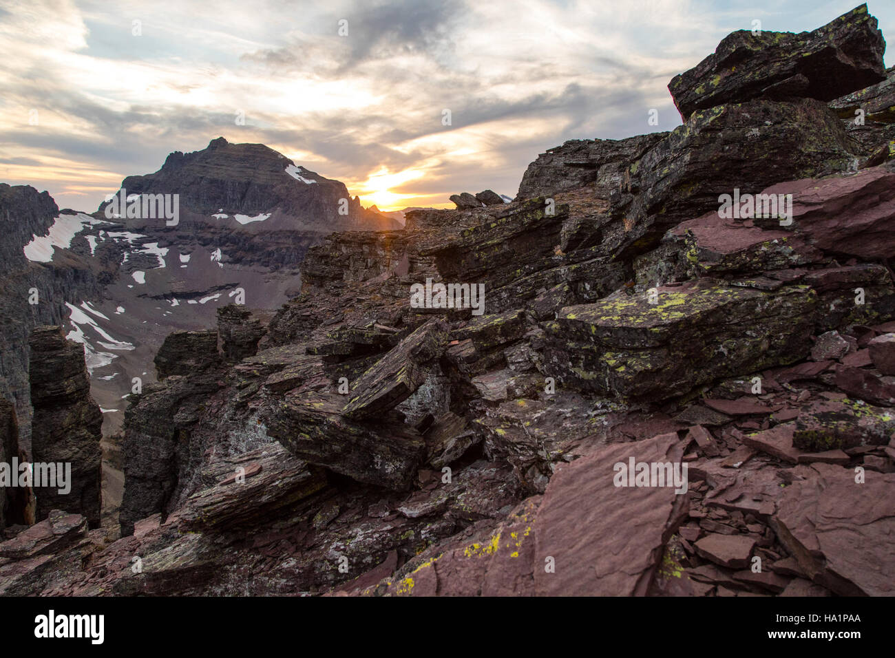 This image depicts an alpine sunset over Mount Cannon in Glacier ...