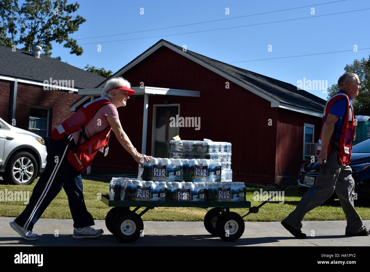 This image shows volunteers and Red Cross workers providing essential ...