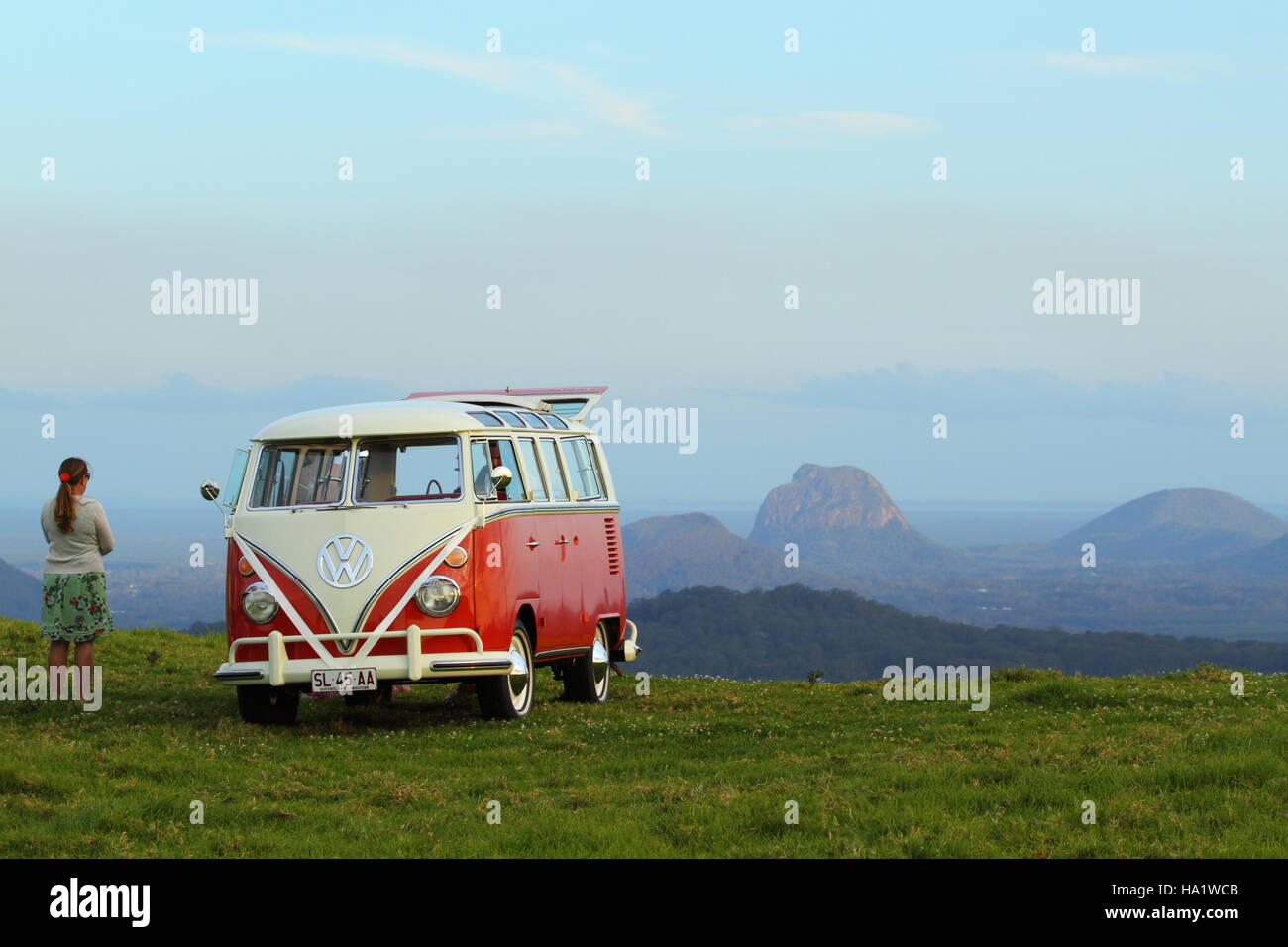A VW Combi bus at dusk on front of the Glasshouse Mountains at Maleny ...