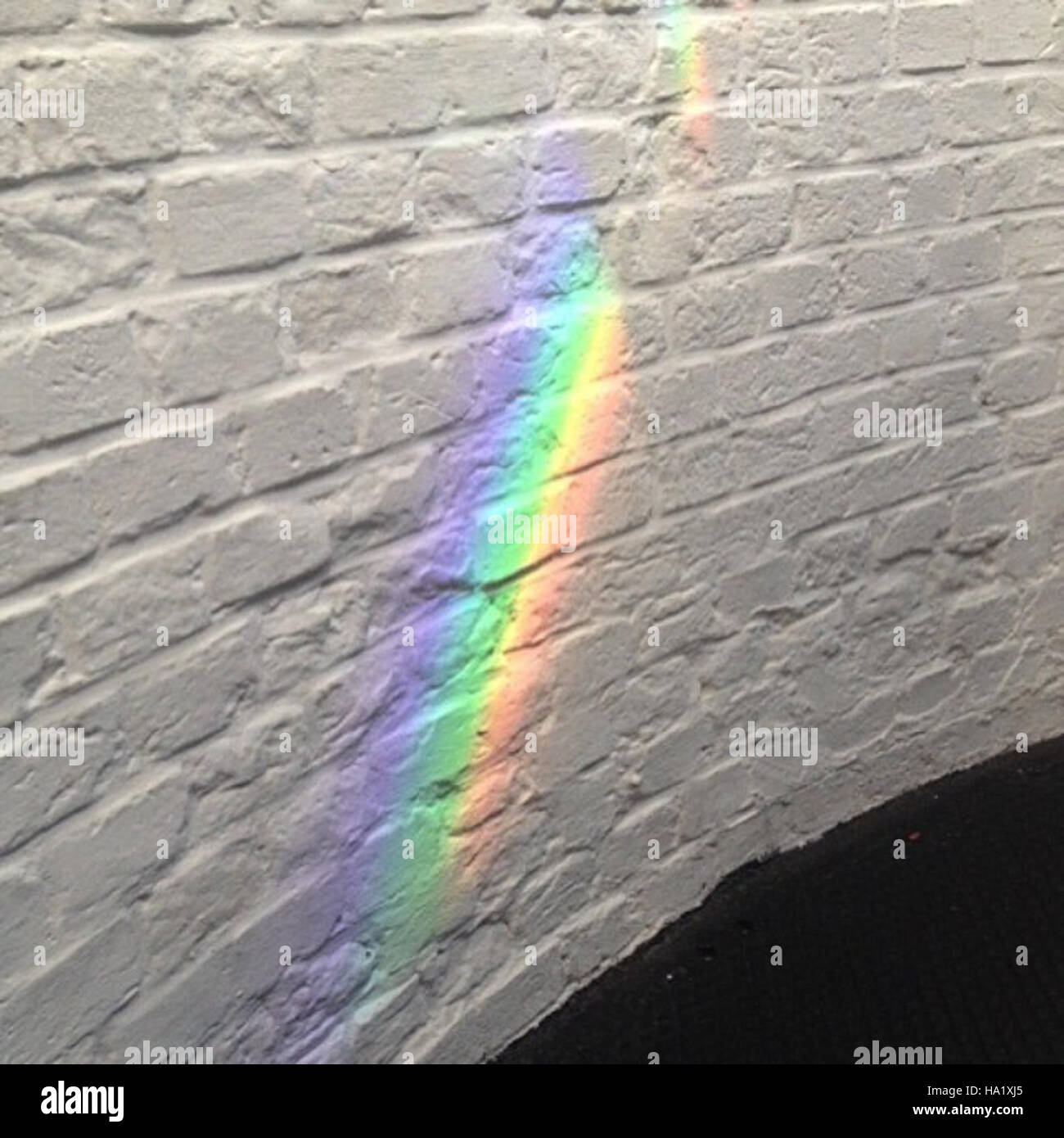 A rainbow over the lighthouse lens at Cape Hatteras National Park ...
