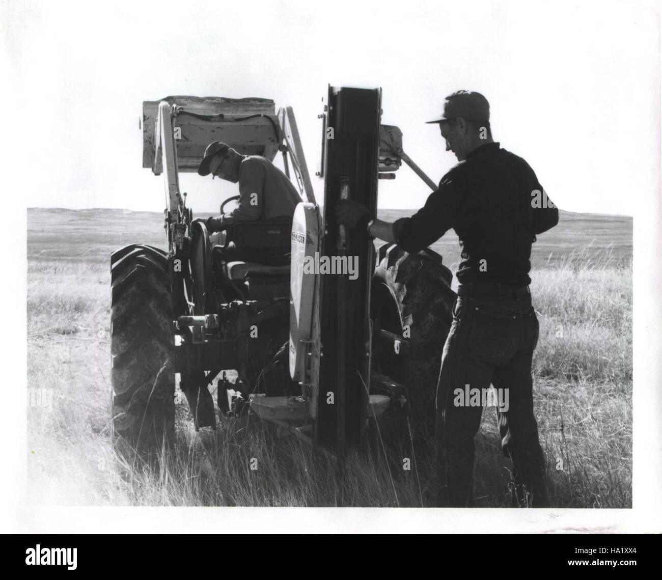 This image shows the use of a steel post driver in Badlands National ...