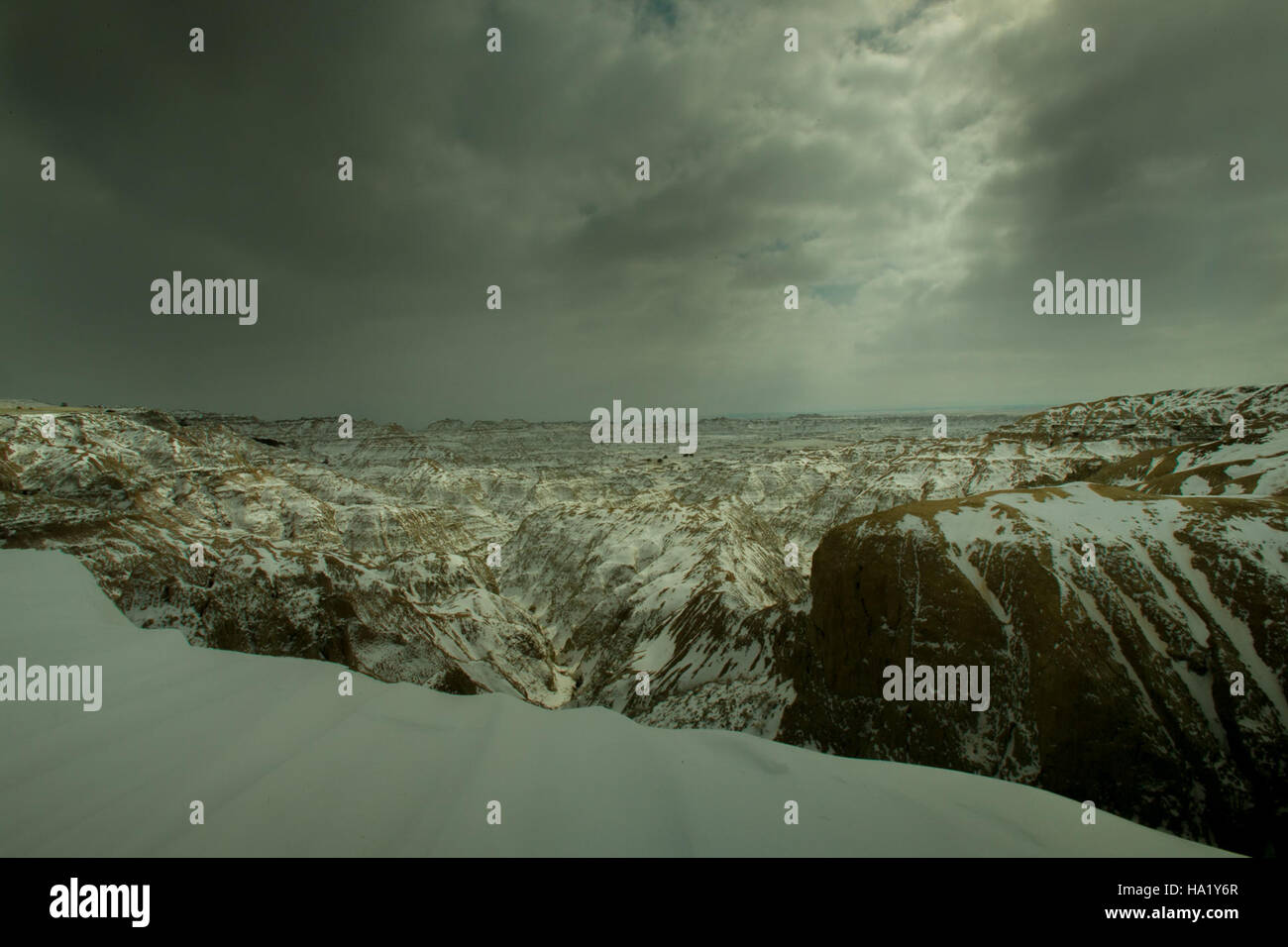 This image captures the stunning Badlands formations covered in snow ...