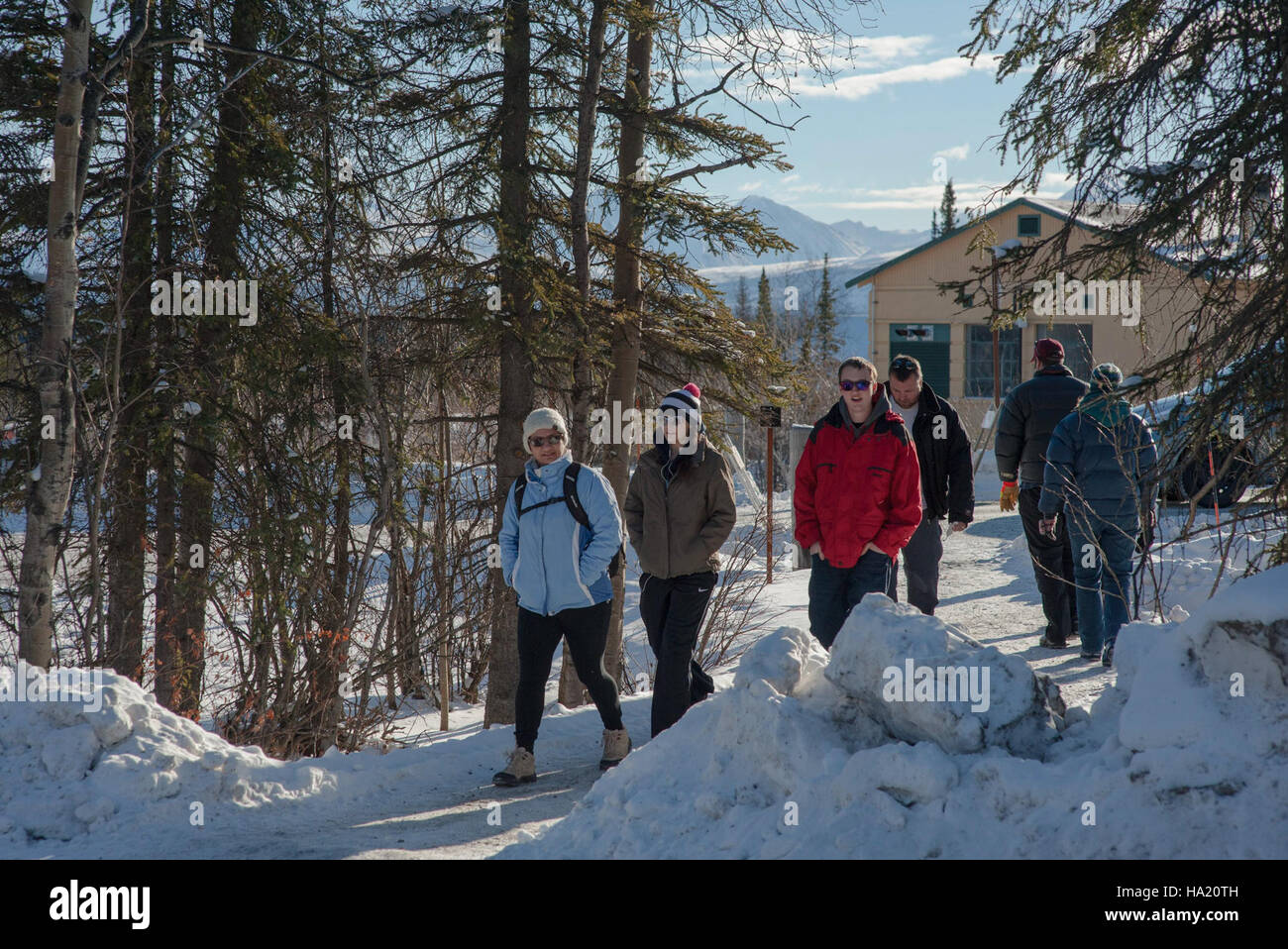Visitors enjoy walking along a scenic path in Denali National Park ...