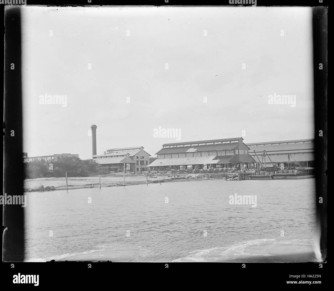 A historic waterfront scene from the early 20th century, preserved in ...