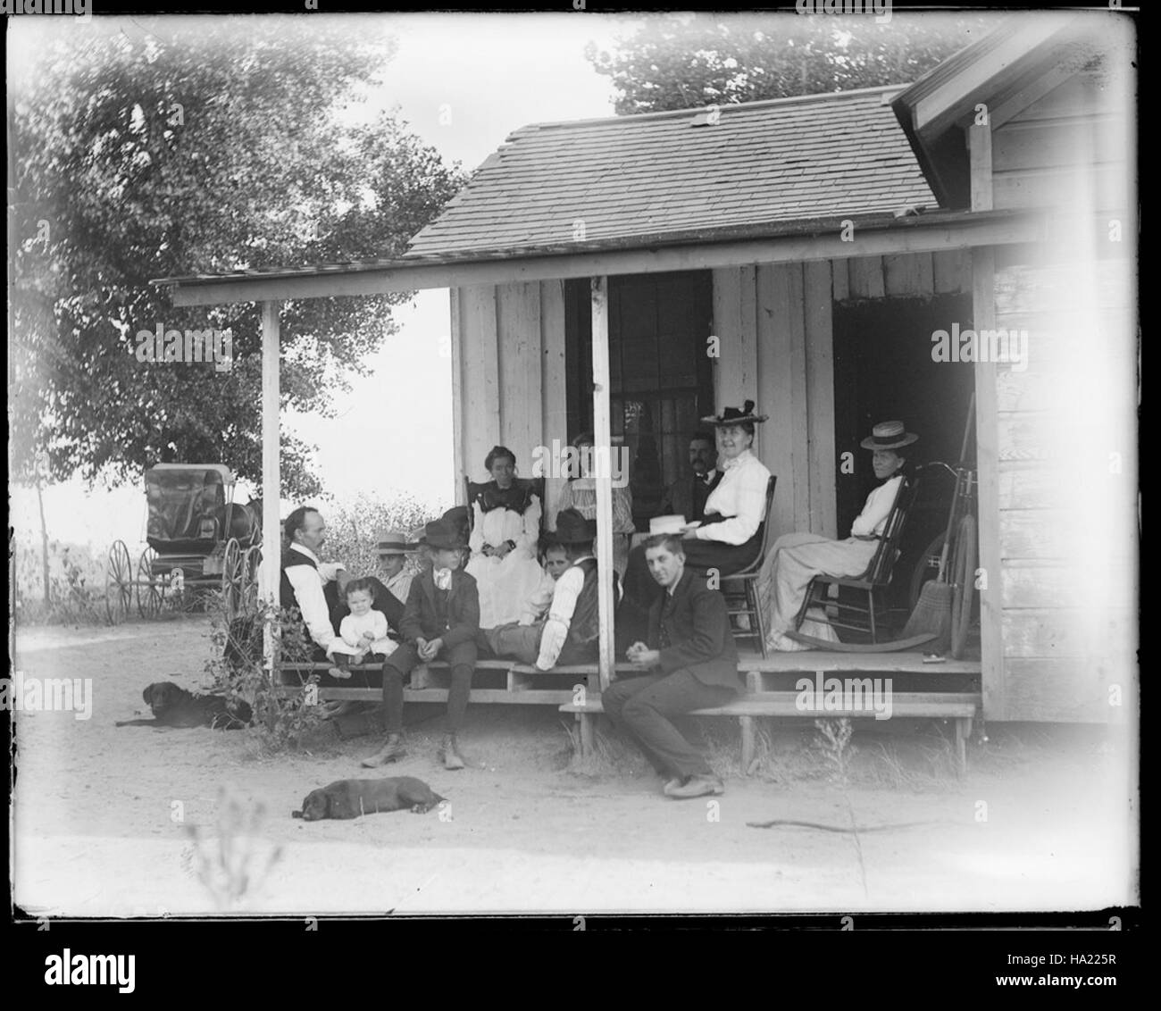 Group seated on porch hi-res stock photography and images - Alamy
