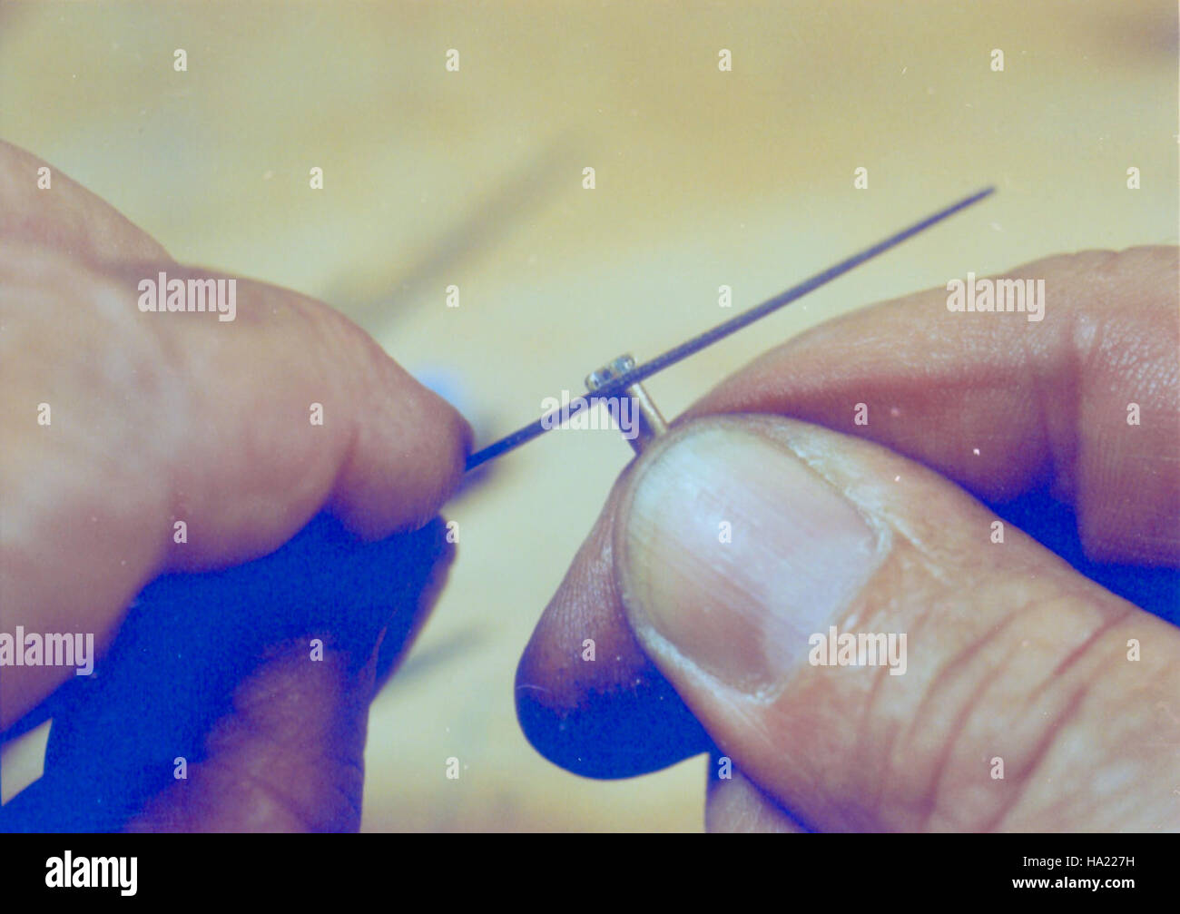 The process of making a mast band for a model of the Kathleen, a ...