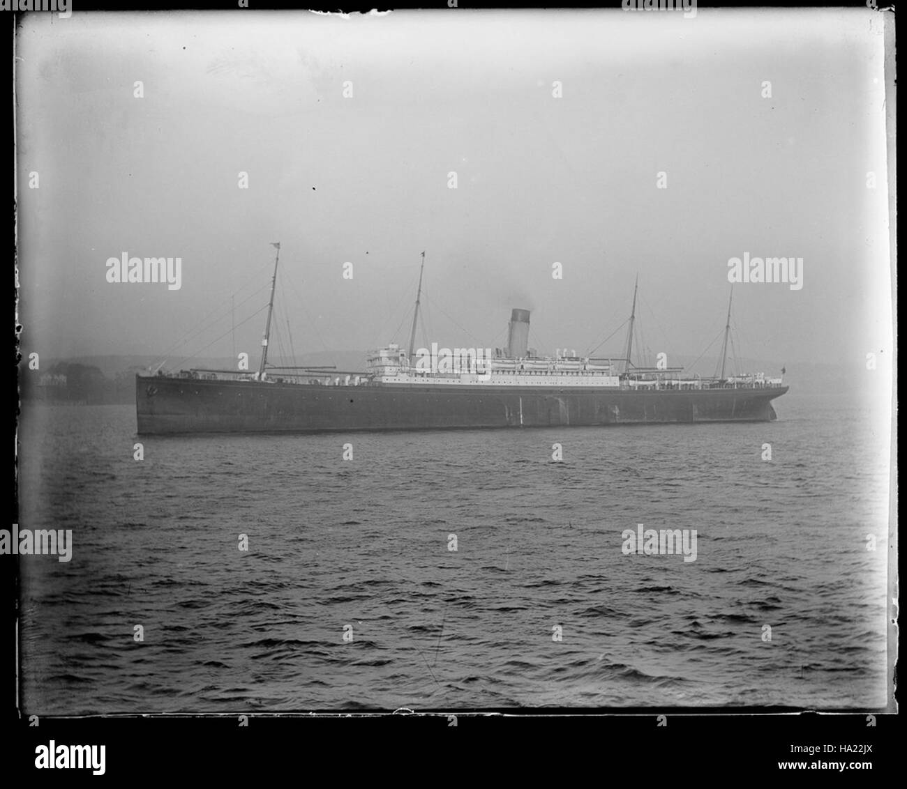 A historic photo of a merchant vessel underway, taken around 1900-1920 ...