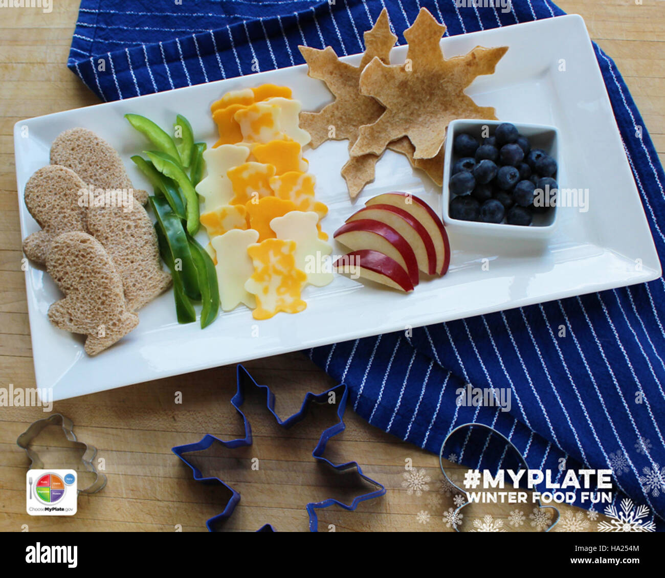 A selection of food items, including sandwiches, green peppers, cheese ...