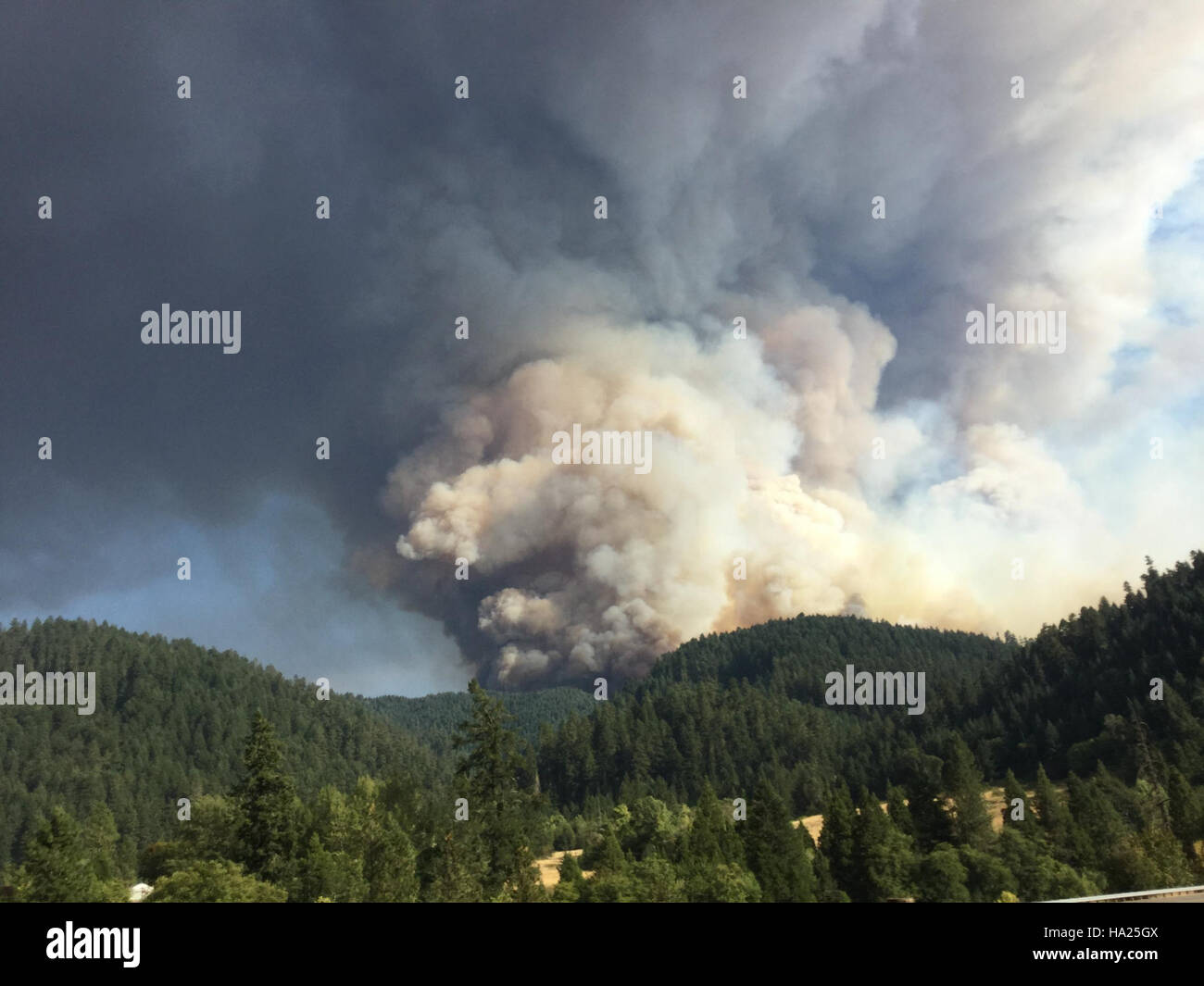 A wildfire in Oregon is shown here, with firefighting efforts and ...
