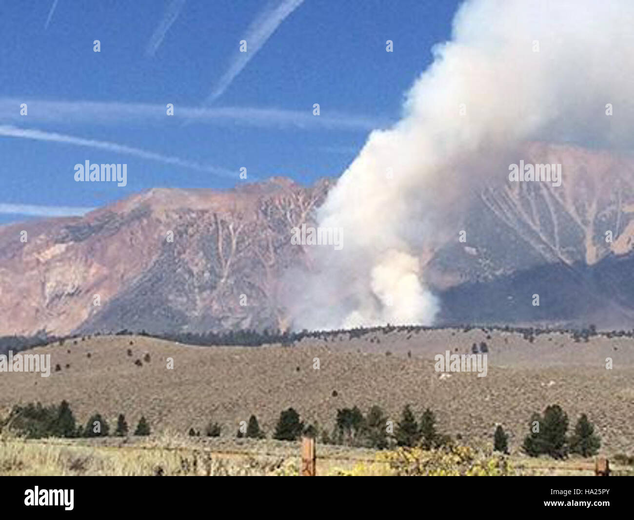 This image shows the aftermath of a wildfire in California ...