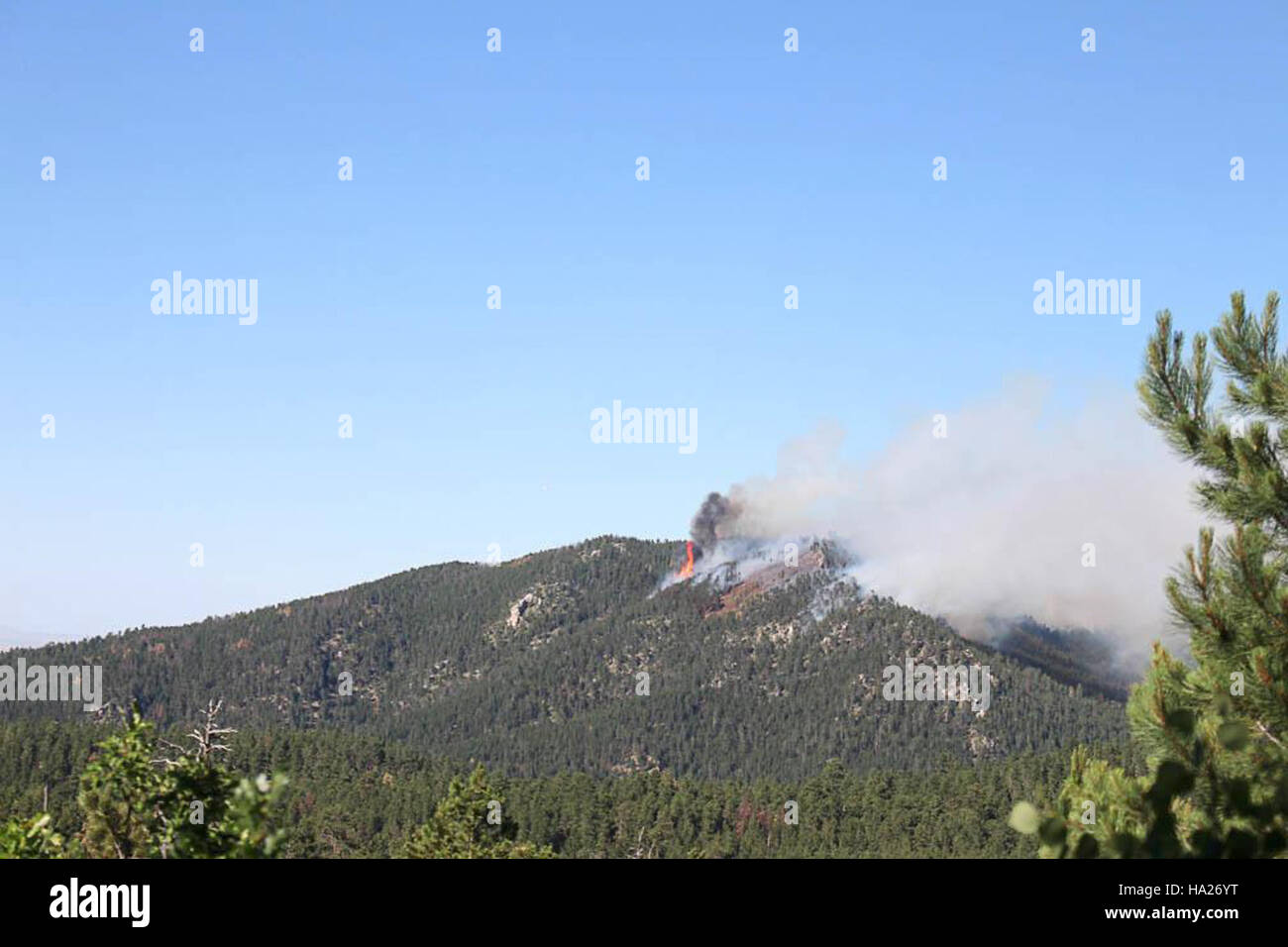 This image captures the Crow Peak Fire, a wildfire event that impacted ...