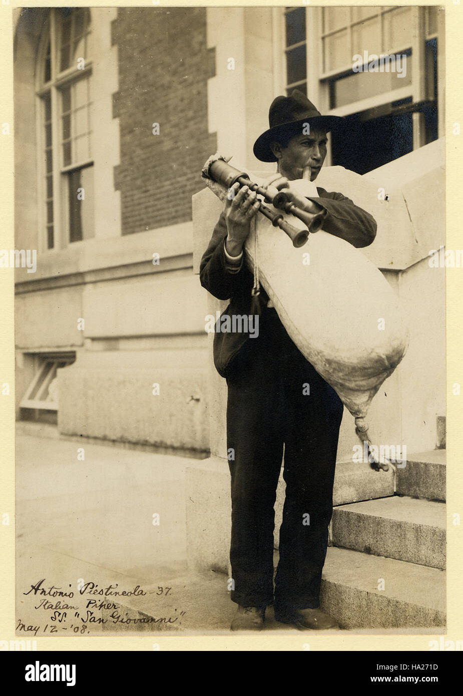 An Italian piper performs at Ellis Island National Park, offering a ...