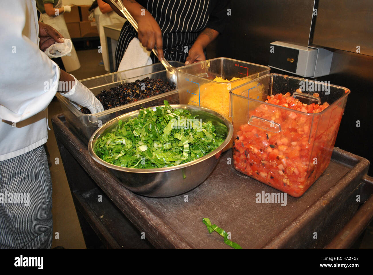 USDA employees prepare food at a central kitchen, demonstrating the ...