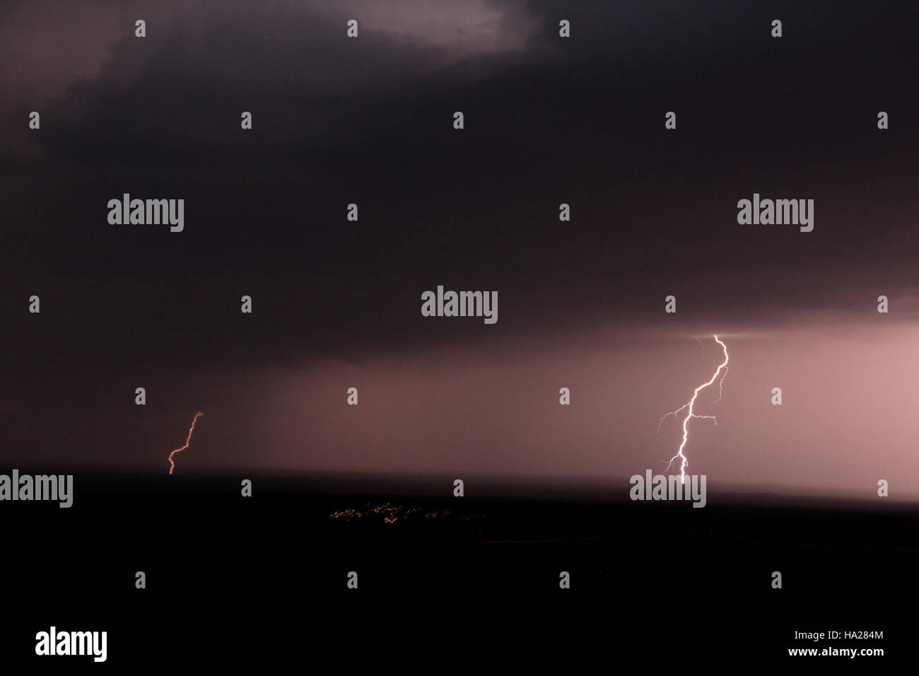 A dramatic lightning strike captured at Badlands National Park ...