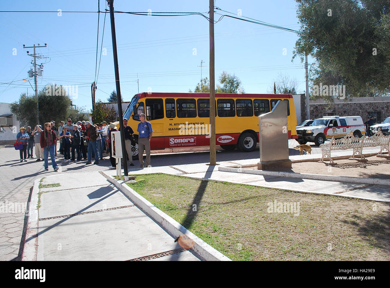 A unique and interesting bus design can be seen at an outdoor park ...