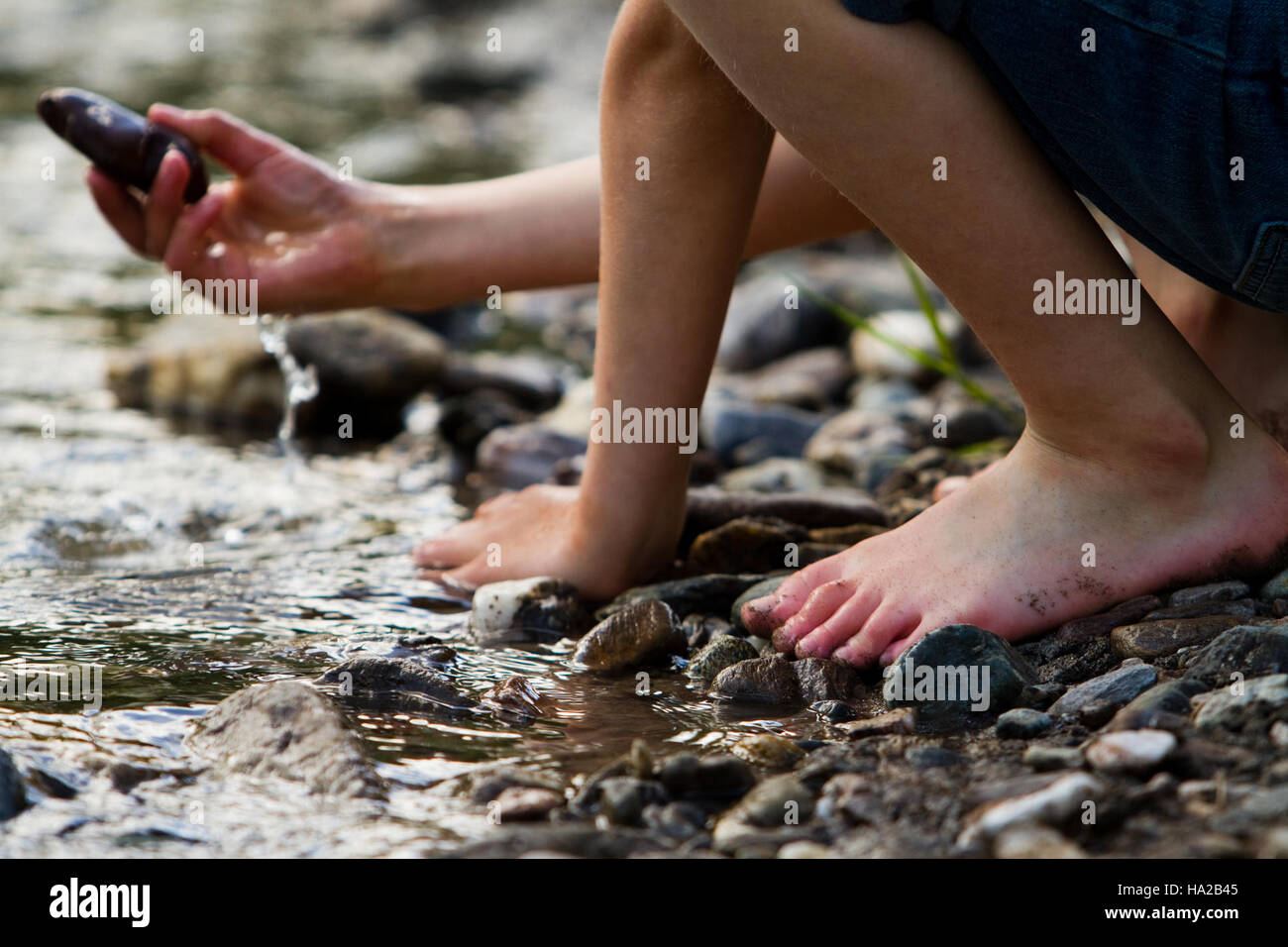 The image titled 'Wet Fingers and Toes' captures a natural moment of a ...