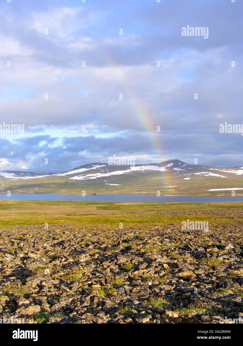 The Bering Land Bridge, shown with a rainbow over Kuzitrin Lake, is a ...