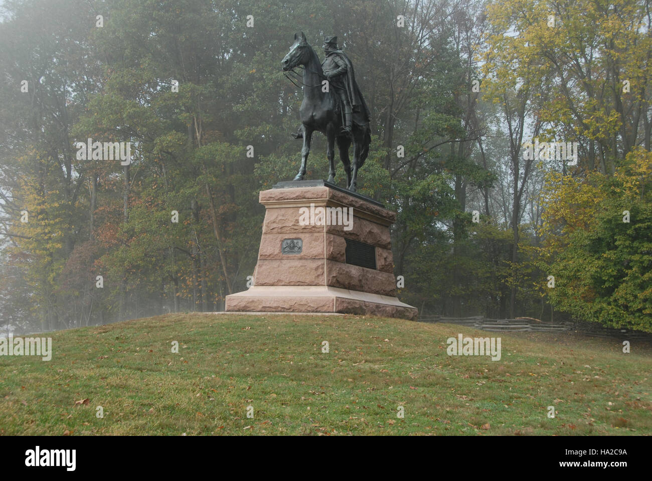 A fall scene in Valley Forge National Park, capturing the misty fog and ...