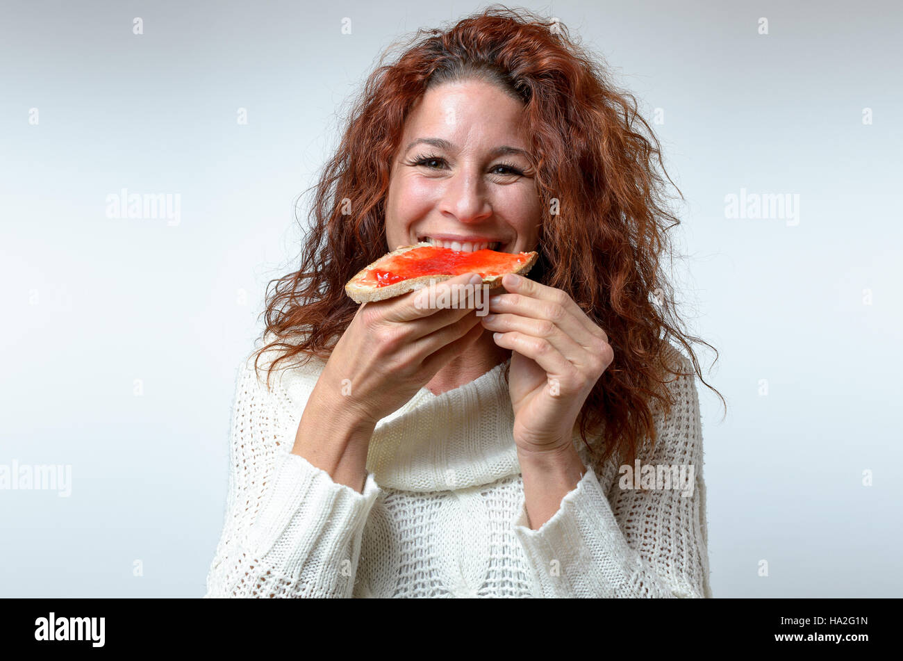 Woman biting into sandwich hi-res stock photography and images - Alamy